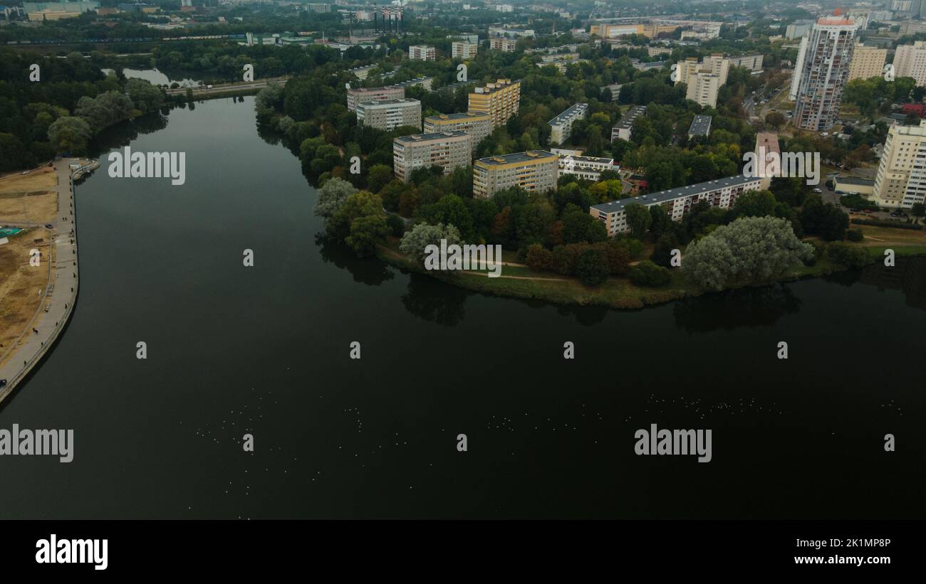 Lake in the city park. Urban landscape. Dormitory area of a big city ...