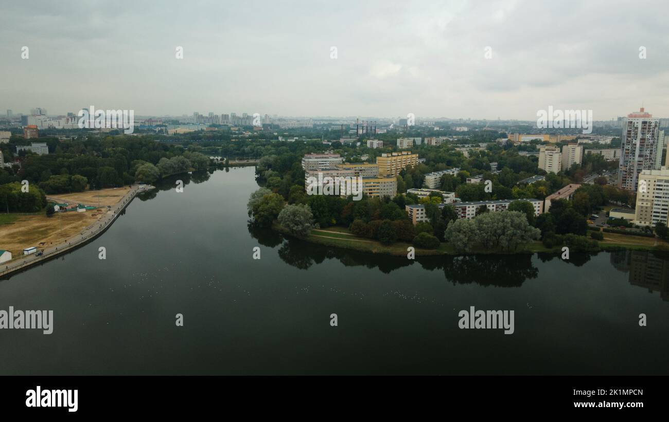 Lake in the city park. Urban landscape. Dormitory area of a big city ...