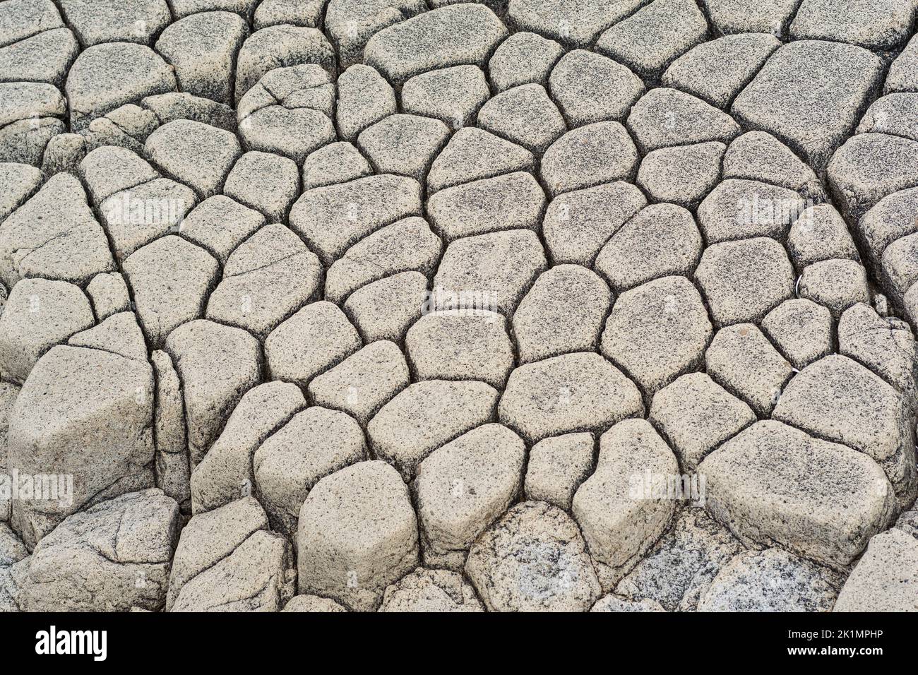 natural stone background, the remains of lava basalt columns form a ...