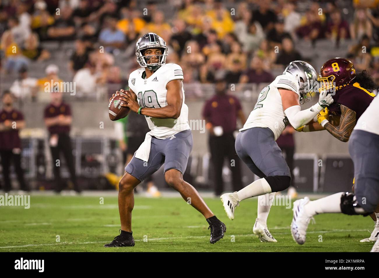 Eastern Michigan Eagles quarterback Austin Smith (19) looks down field ...