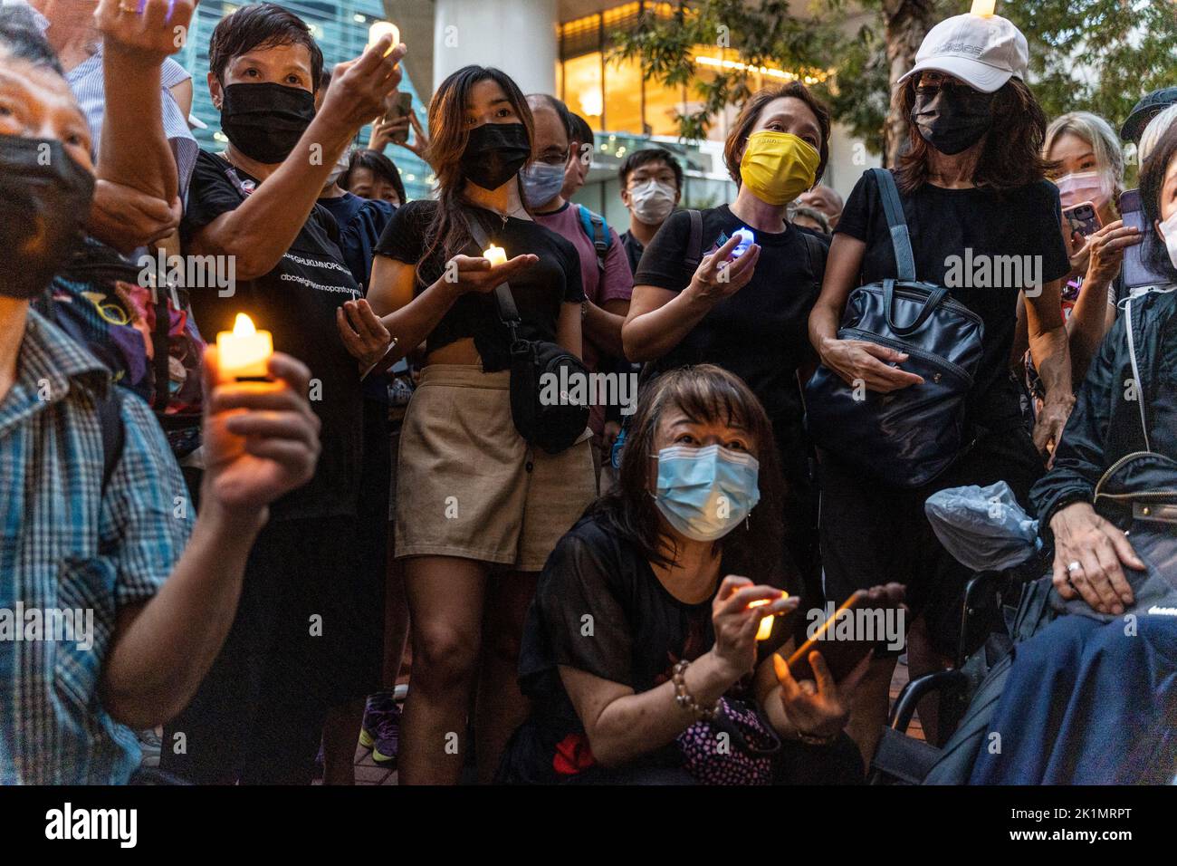Members of the public hold lit candles as they pay tribute to Queen ...