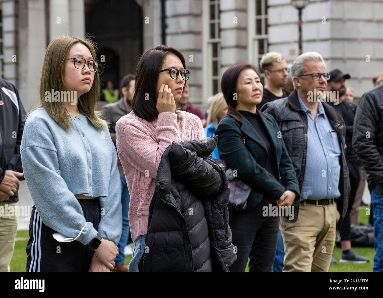 People in the grounds of Belfast City Hall watch Queen Elizabeth II ...