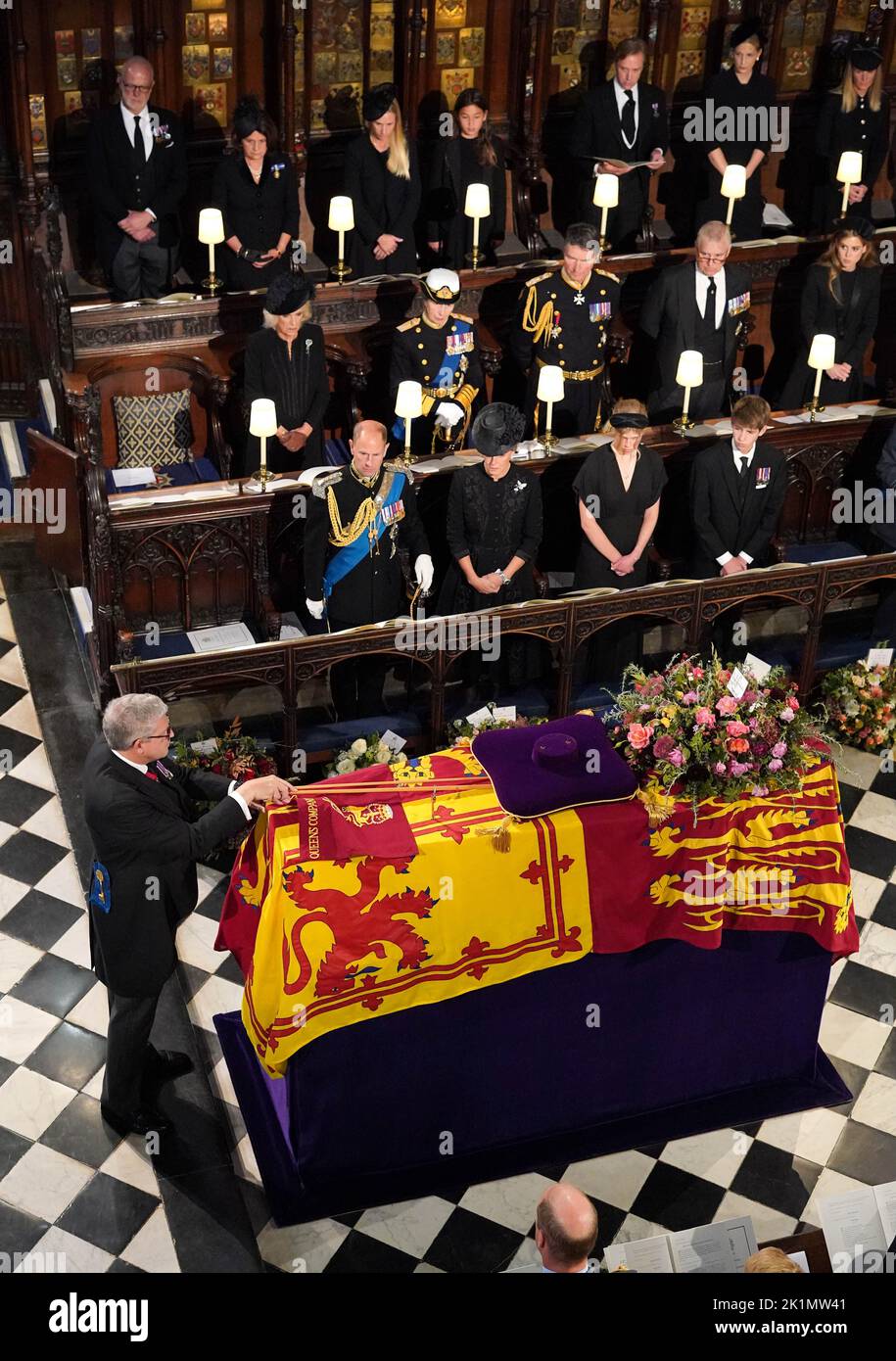 The Lord Chamberlain ceremonially breaks his wand of office on the coffin at the Committal ...