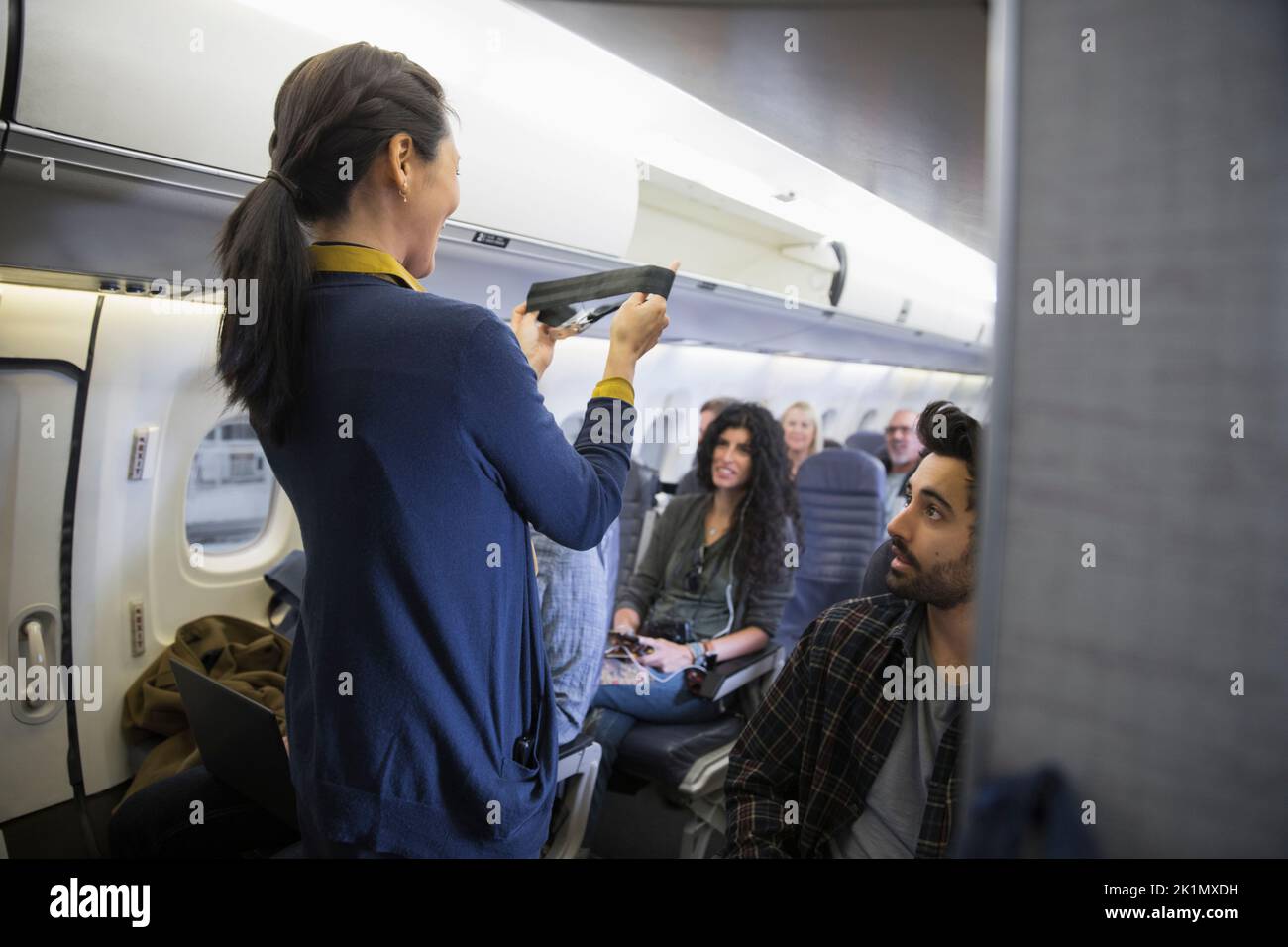 Flight attendant safety belt hi-res stock photography and images - Alamy