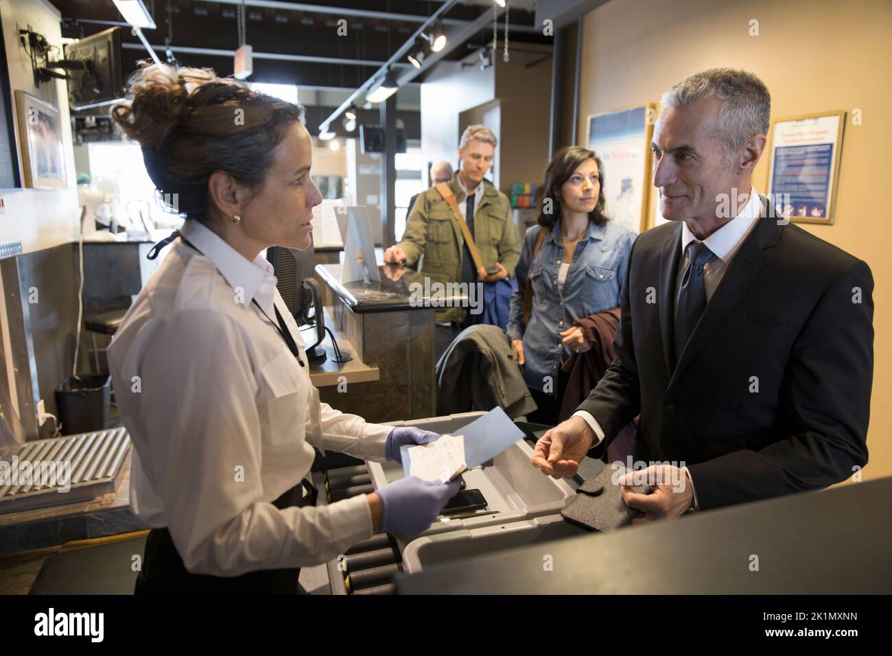 Mature woman showing ticket airport hi-res stock photography and images ...