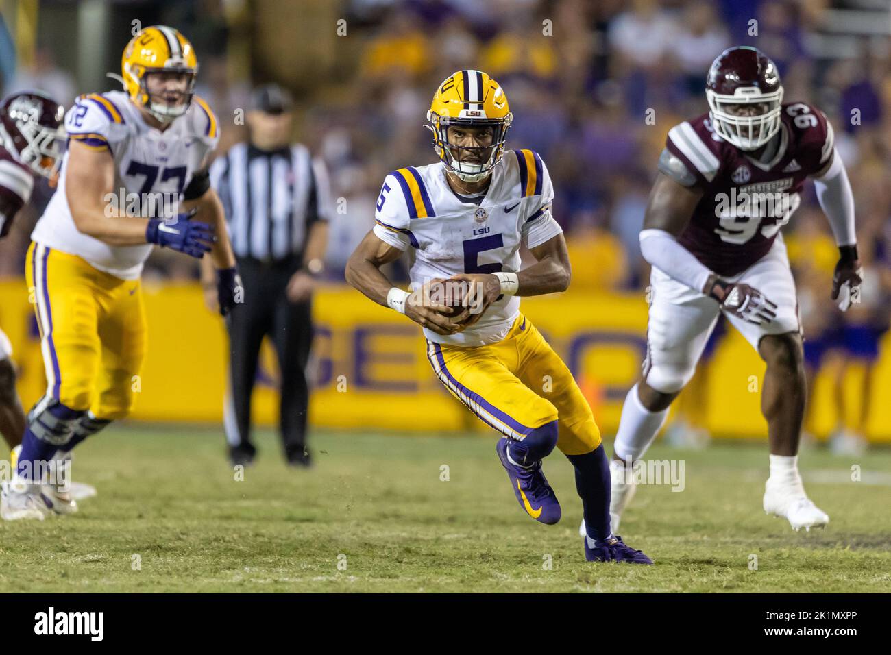 LSU Tigers quarterback Jayden Daniels (5) runs against Mississippi ...