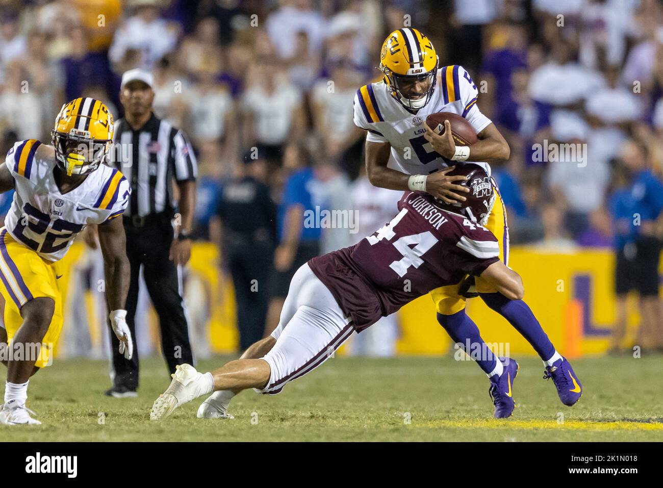 LSU Tigers quarterback Jayden Daniels (5) is tackled by Mississippi ...