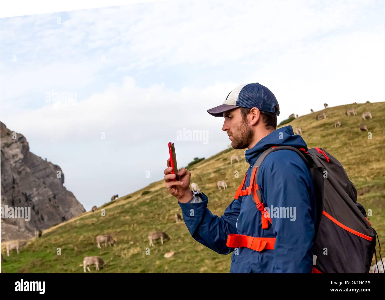backpacker man takes a selfie in the mountains Stock Photo - Alamy