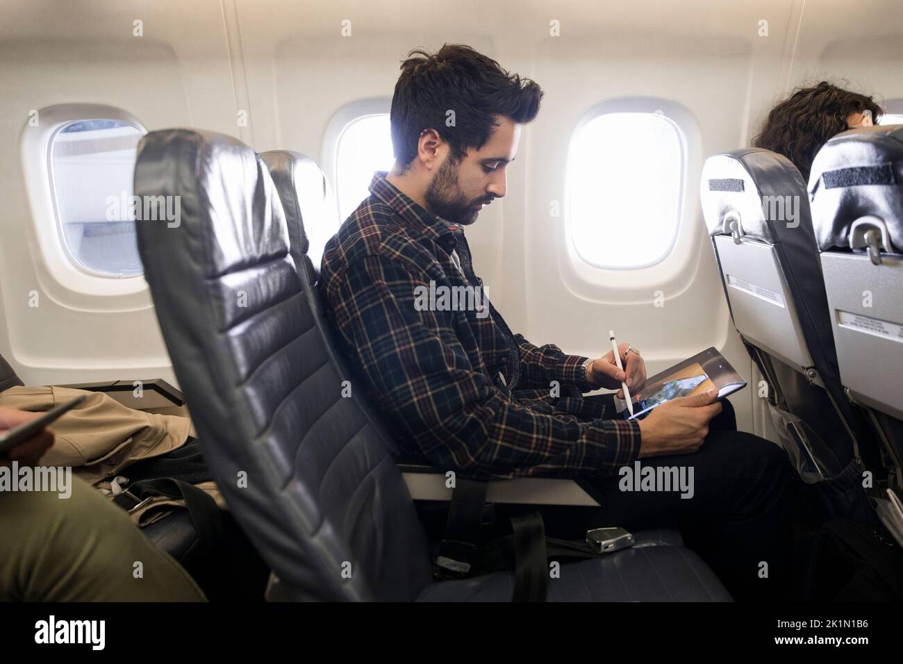 Airplane cabin man hi-res stock photography and images - Alamy