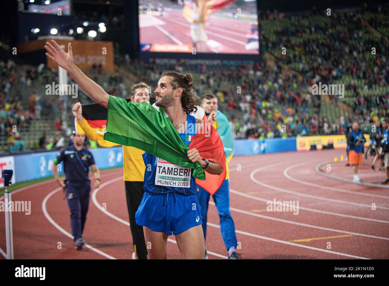 Gianmarco Tamberi with her country's flag as the winner of the High ...