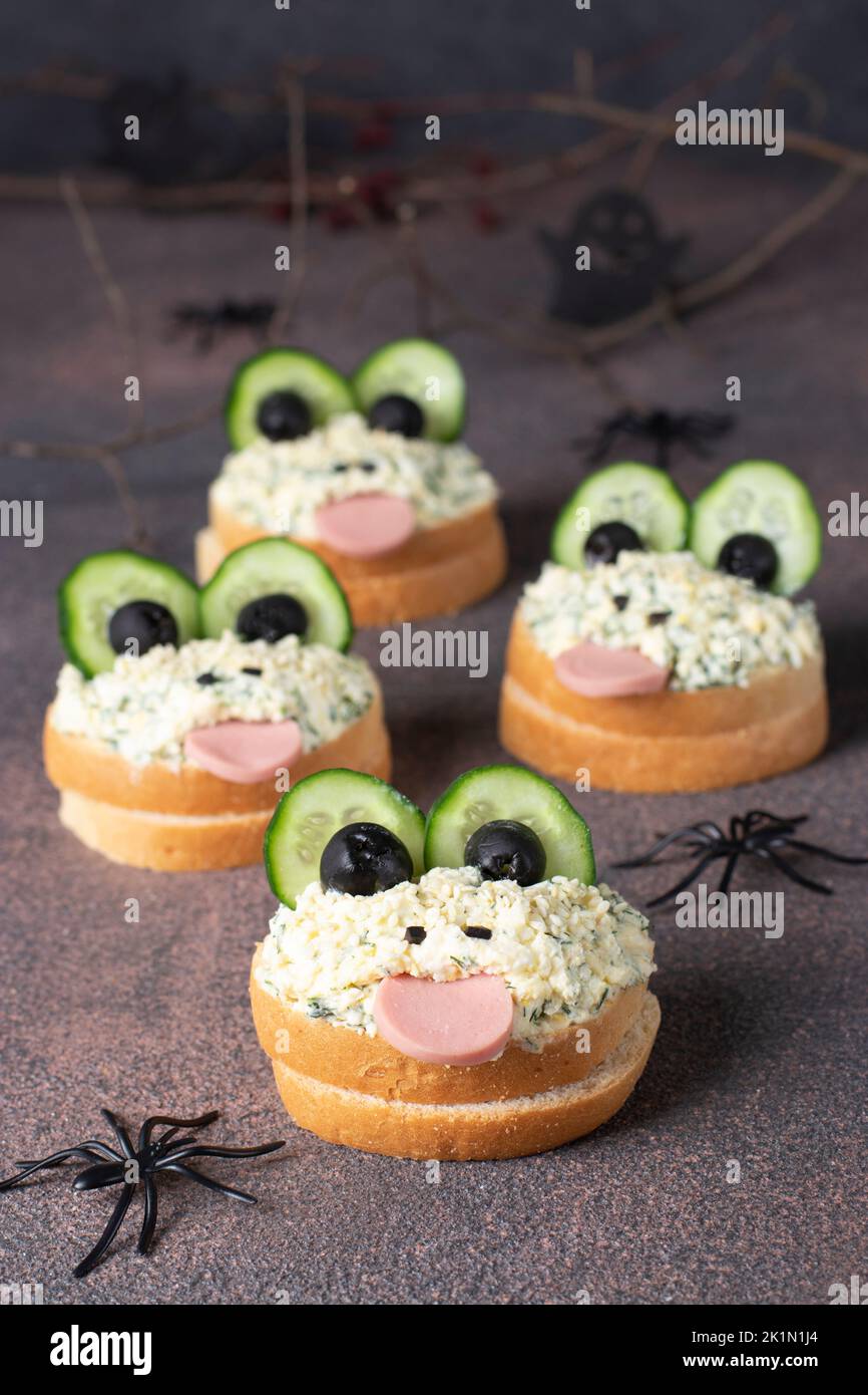 Cucumber, sausage, black olives, egg and melted cheese sandwiches in ...