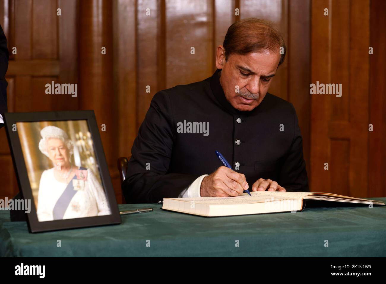 Prime Minister of Pakistan, Shehbaz Sharif, signs a book of condolence ...