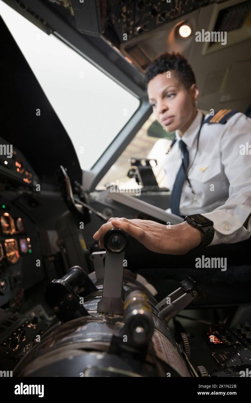 Female pilot in airplane cockpit Stock Photo - Alamy