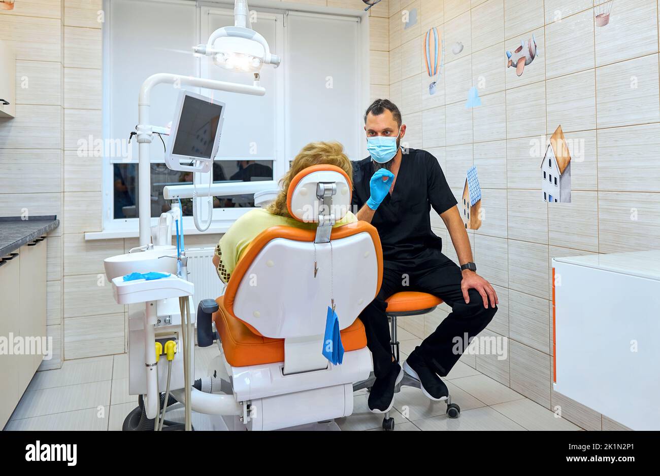 dentist in the office receives the patient Stock Photo - Alamy