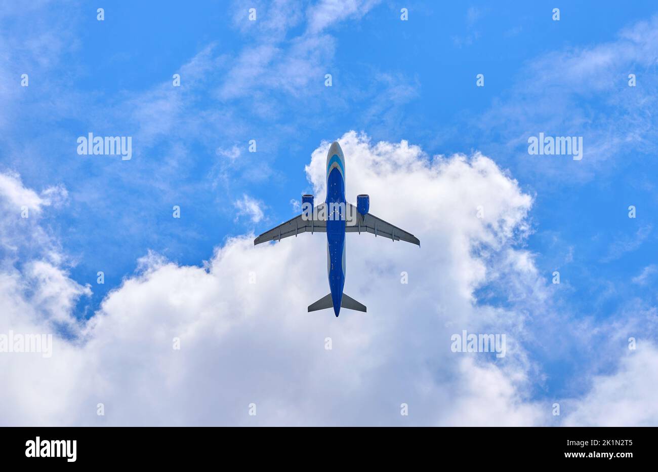 bottom view of a passing passenger plane Stock Photo - Alamy