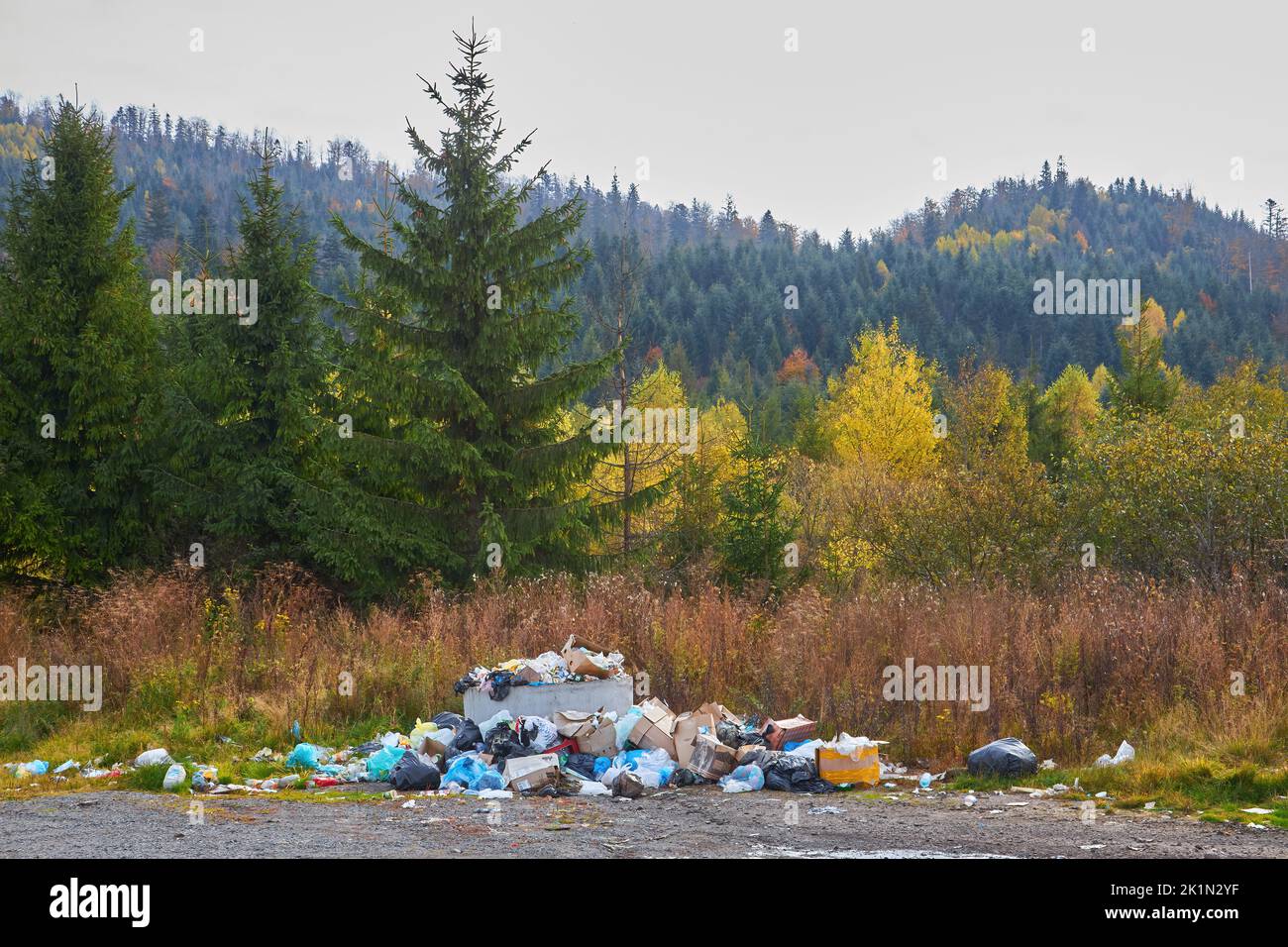 A pile of garbage lies on the background of beautiful mountains Stock ...