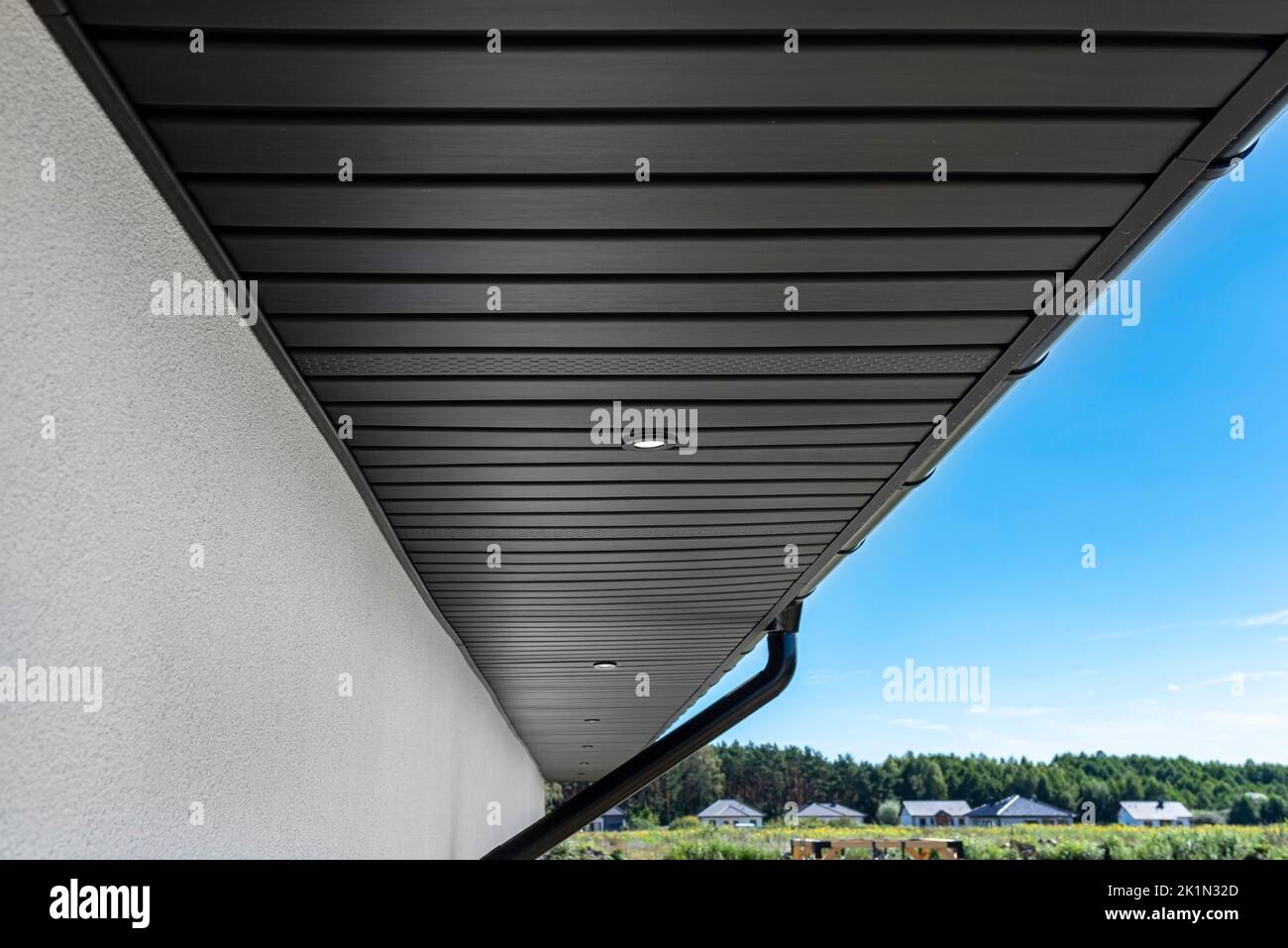 A modern graphite roof lining is attached to the trusses, visible ...