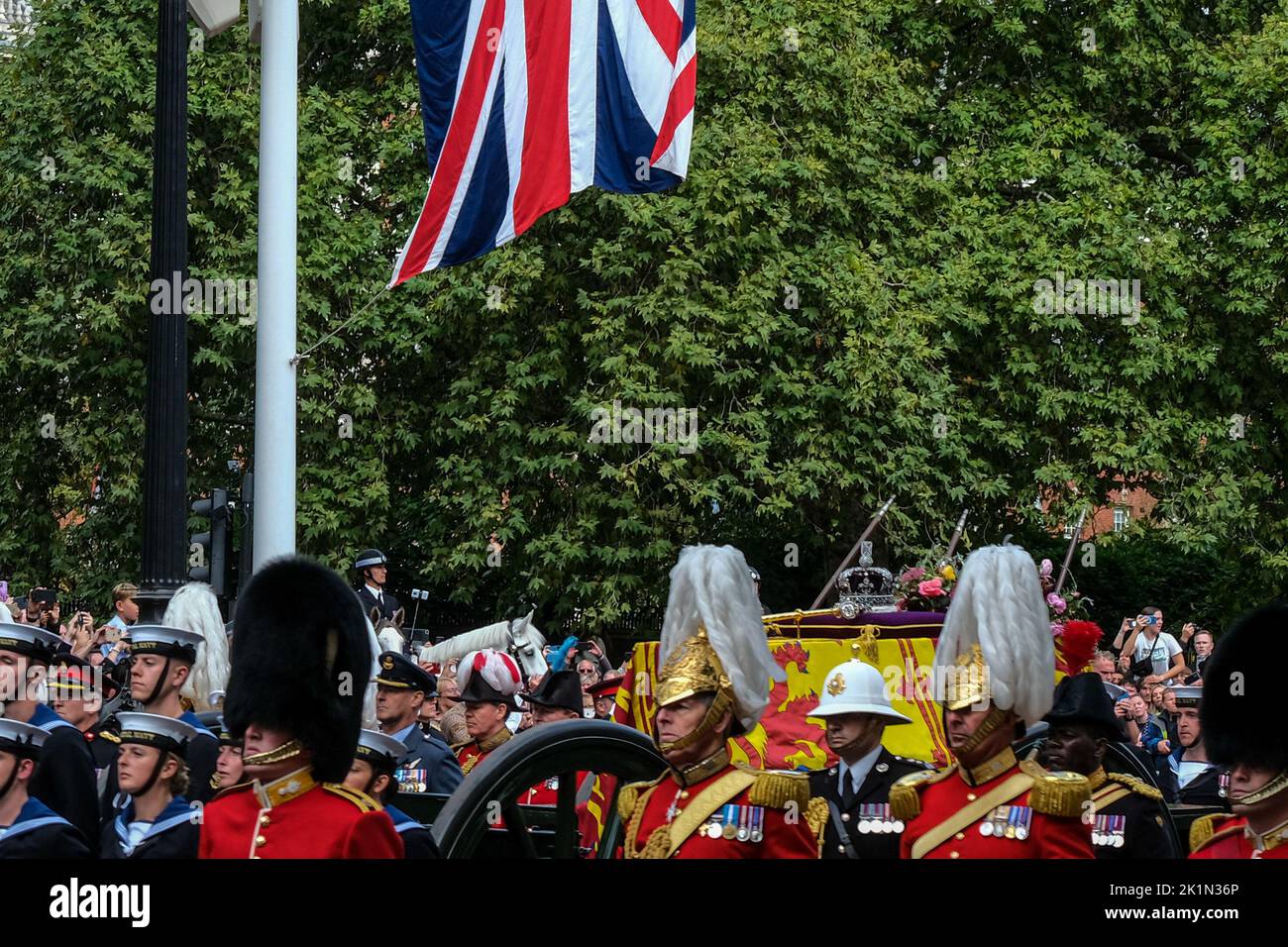 The Queen's coffin is seen accompanied by the troops from Westminster ...