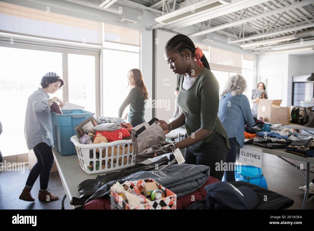 Woman sorting her clothes hi-res stock photography and images - Alamy