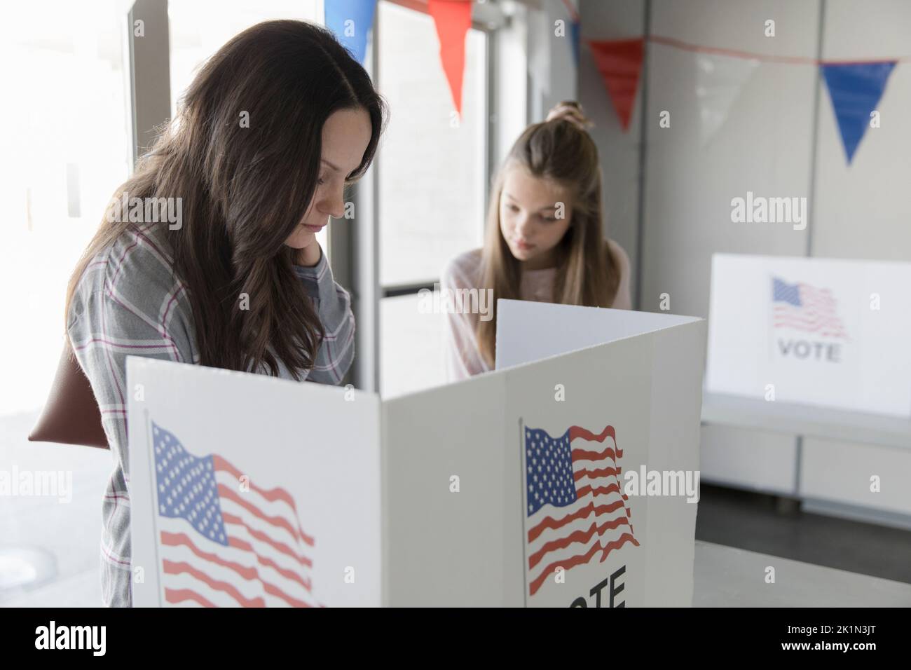Mother child voting booth hi-res stock photography and images - Alamy