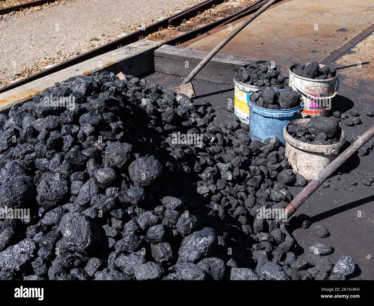 Pile of coal with shovels and buckets, ready for the steam train Stock ...
