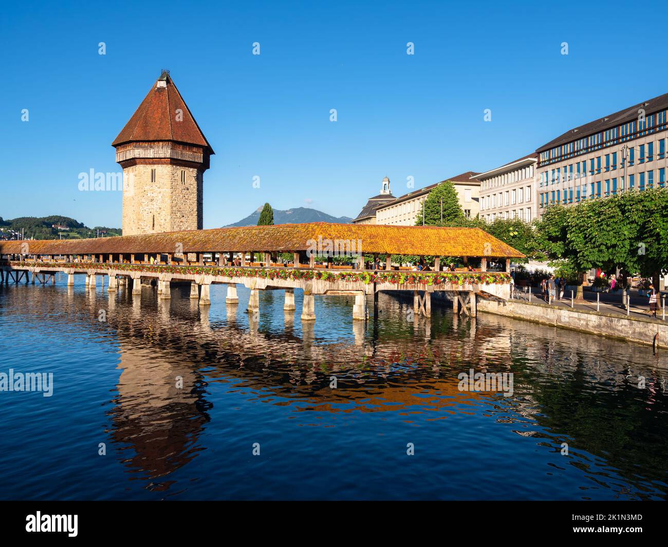 Lucerne, Switzerland - July 11, 2022: The famous wooden medieval bridge ...