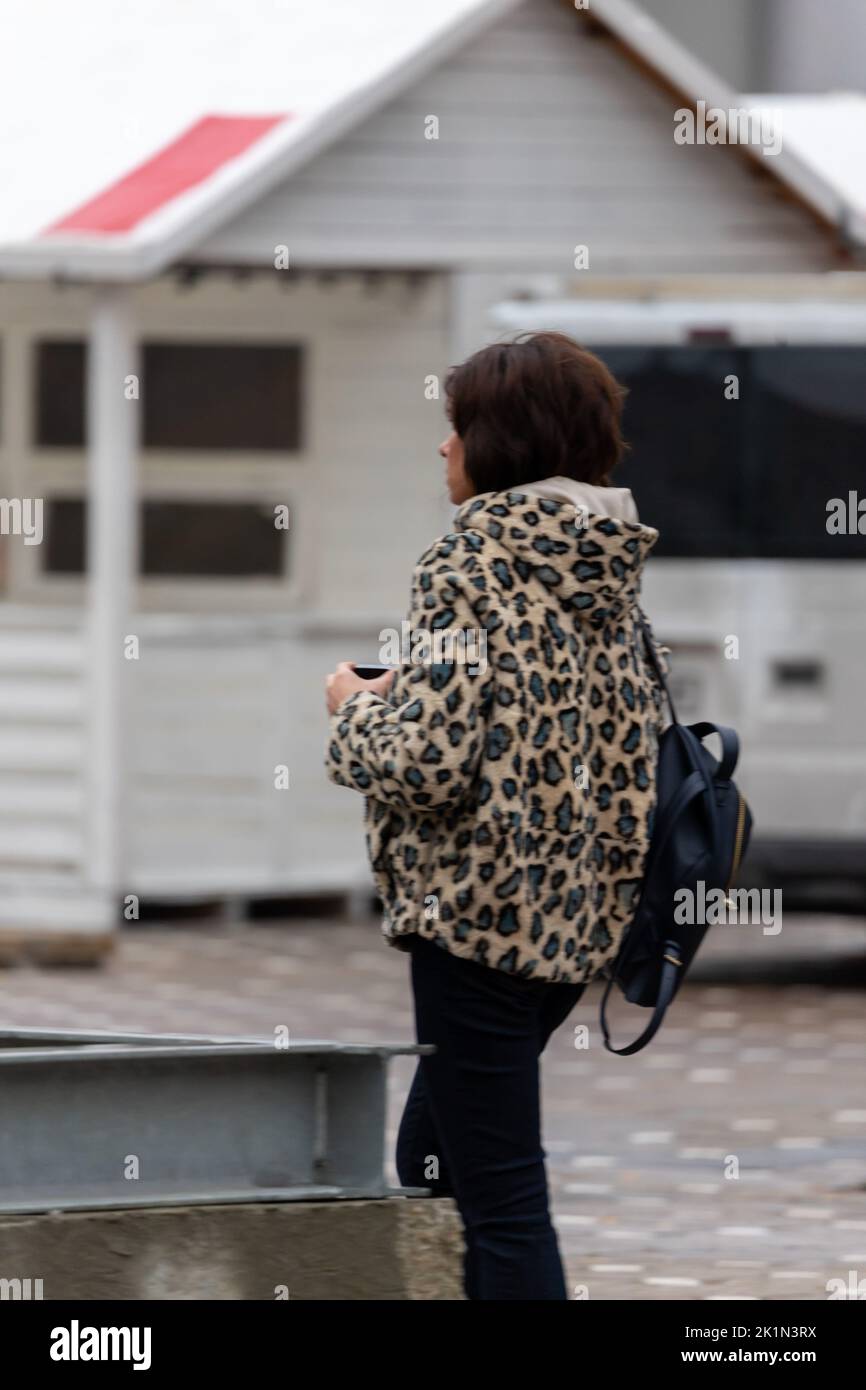 Woman walking on the street. Real people Stock Photo - Alamy