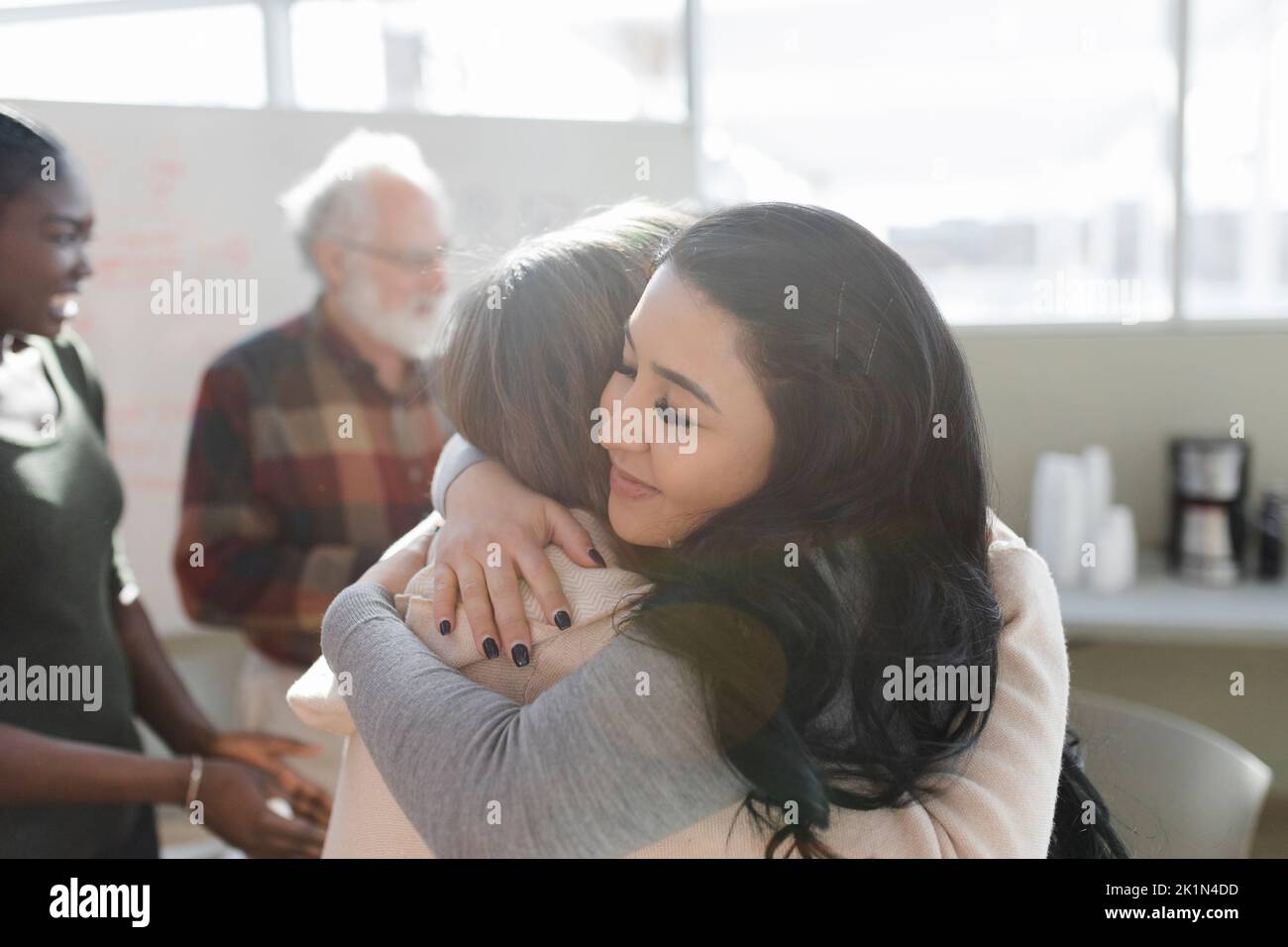 Two women support hi-res stock photography and images - Alamy