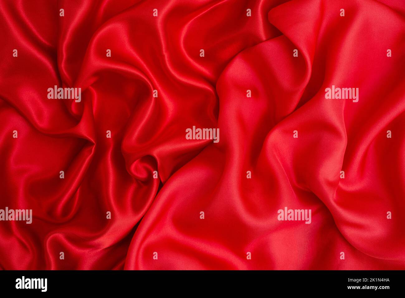 Satin vs silk textures, red fabric quality comparison Stock Photo - Alamy