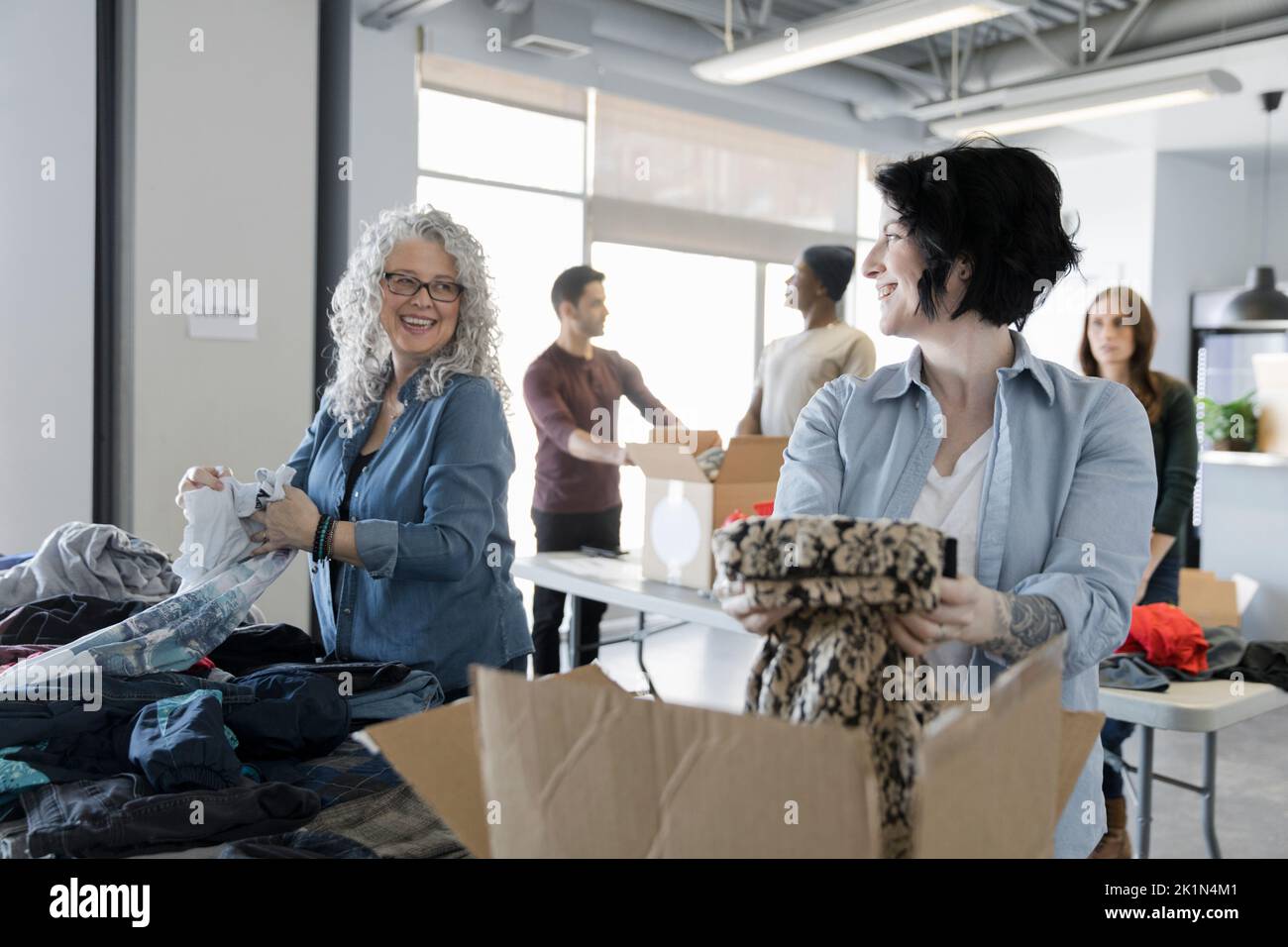Women sorting clothing hi-res stock photography and images - Alamy
