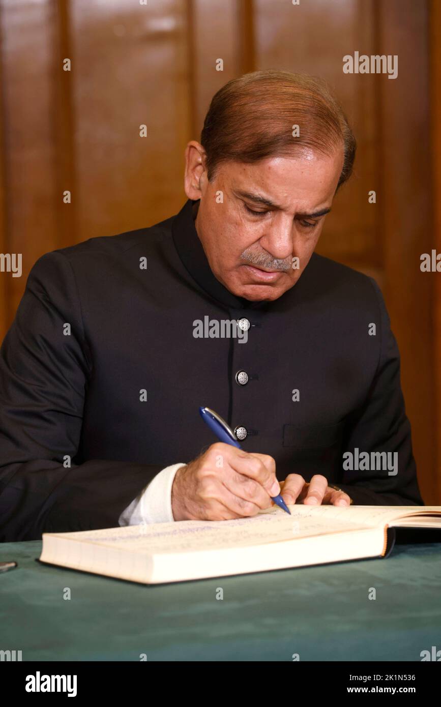 Prime Minister of Pakistan, Shehbaz Sharif, signs a book of condolence ...