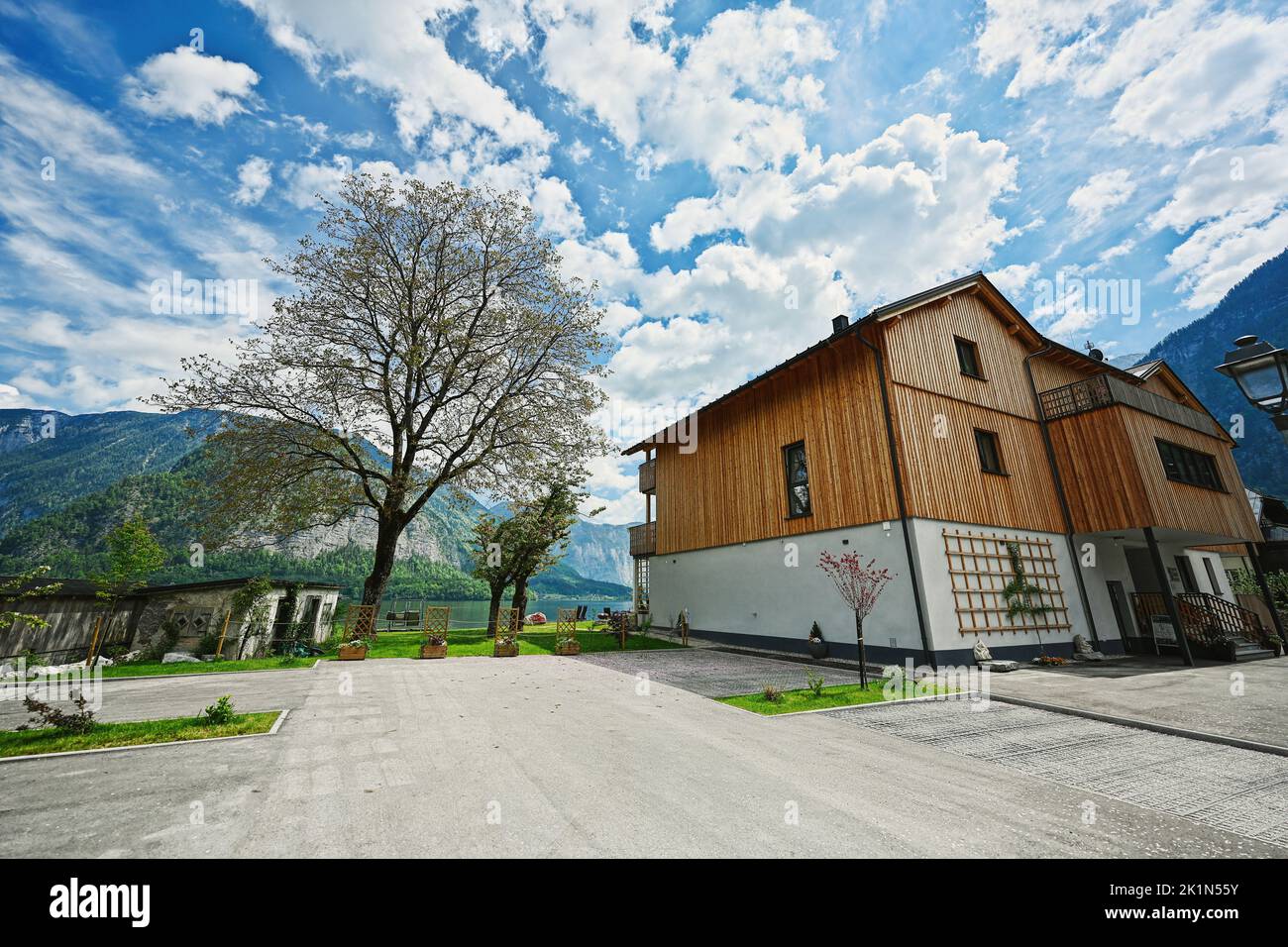 Wooden house and tree in Hallstatt, Austria Stock Photo - Alamy