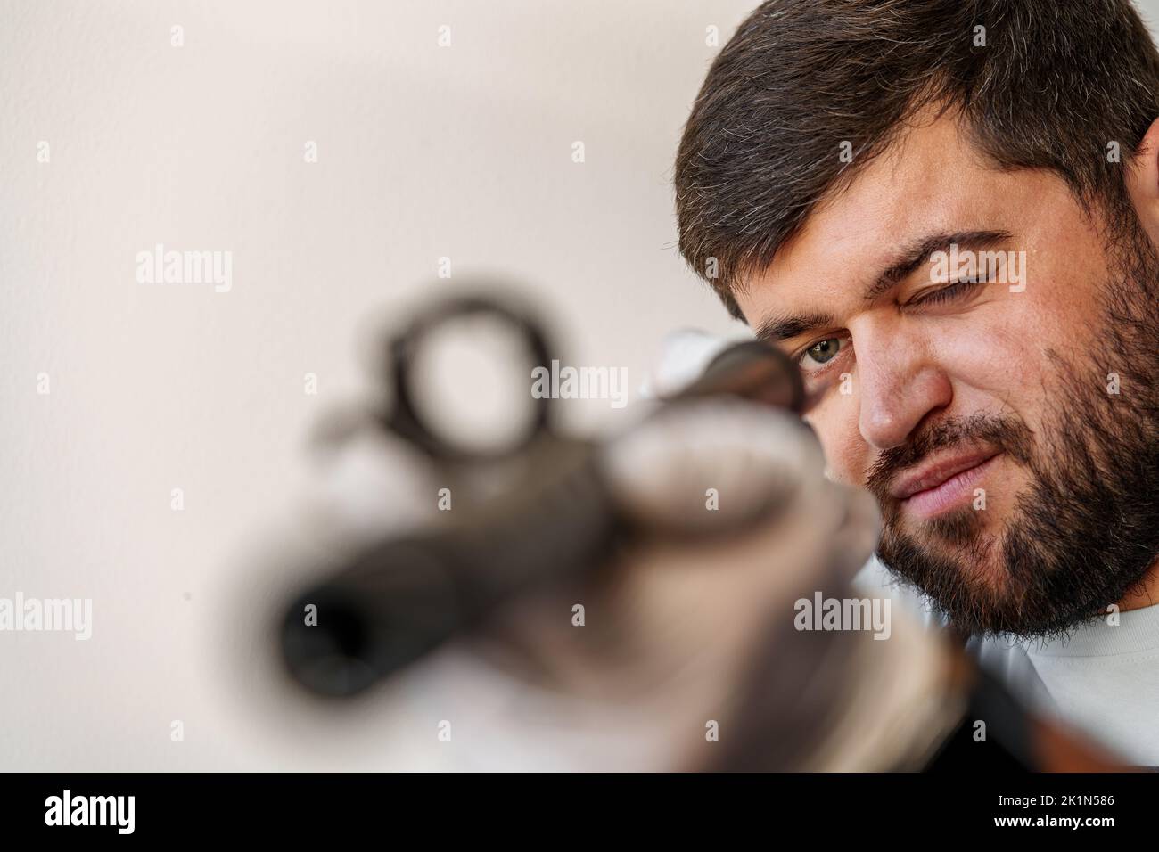 The gunsmith maintaining his rifle in a workshop Stock Photo - Alamy
