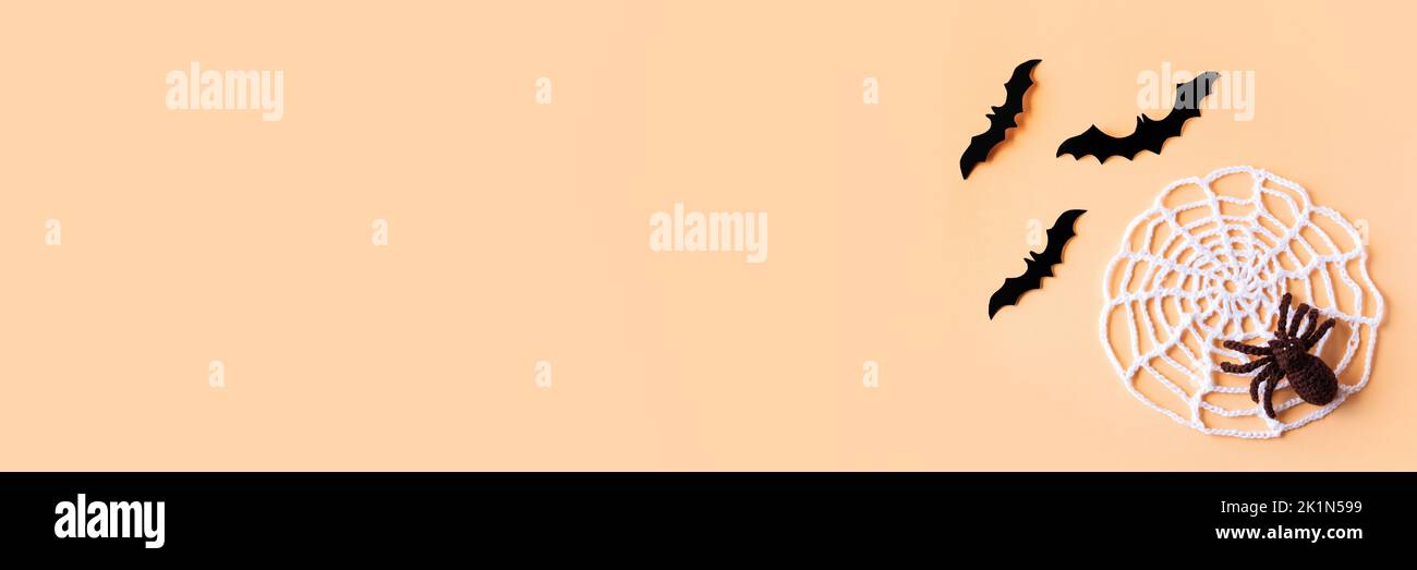 Composition of black bats and a knitted spider, banner. Halloween ...