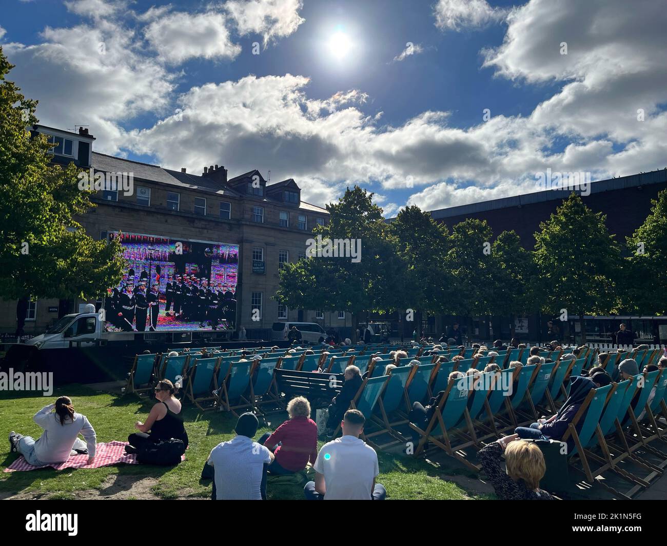 People watch the funeral of Queen Elizabeth II on a big screen in Old ...
