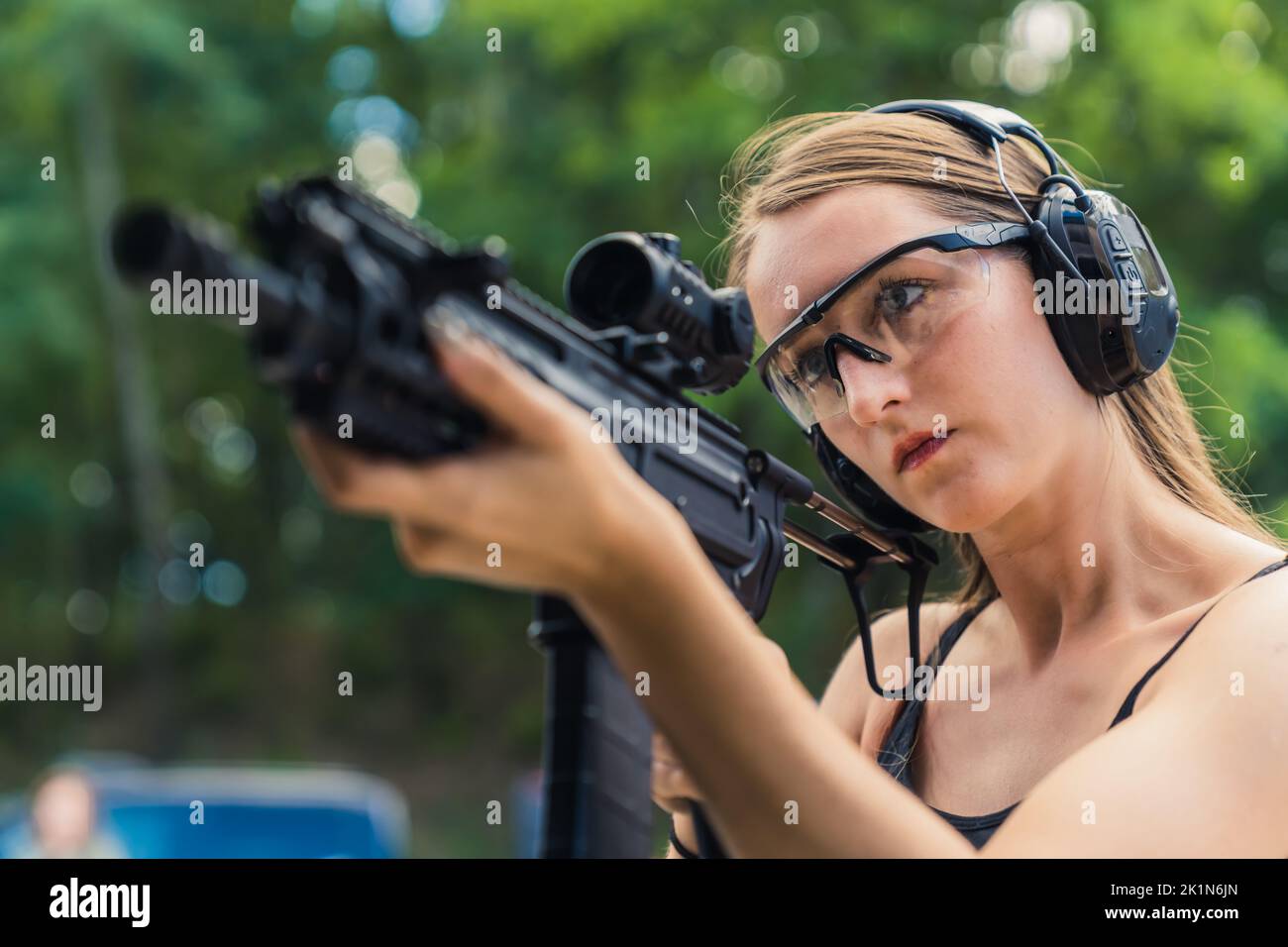 beautiful and confident girl with special equipment looking through the ...