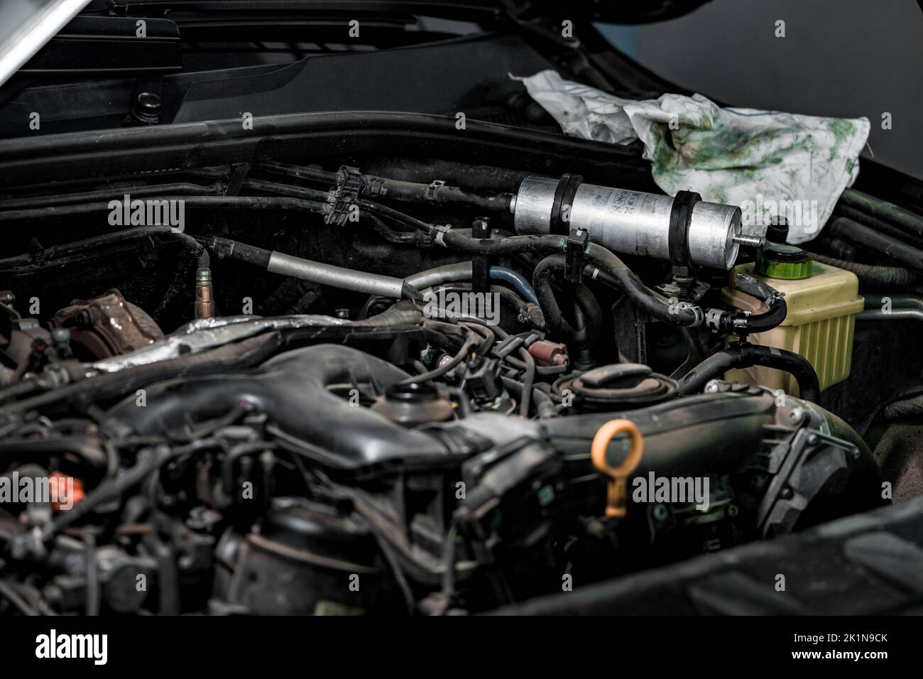 View of engine and other parts under the open hood of a car Stock Photo ...