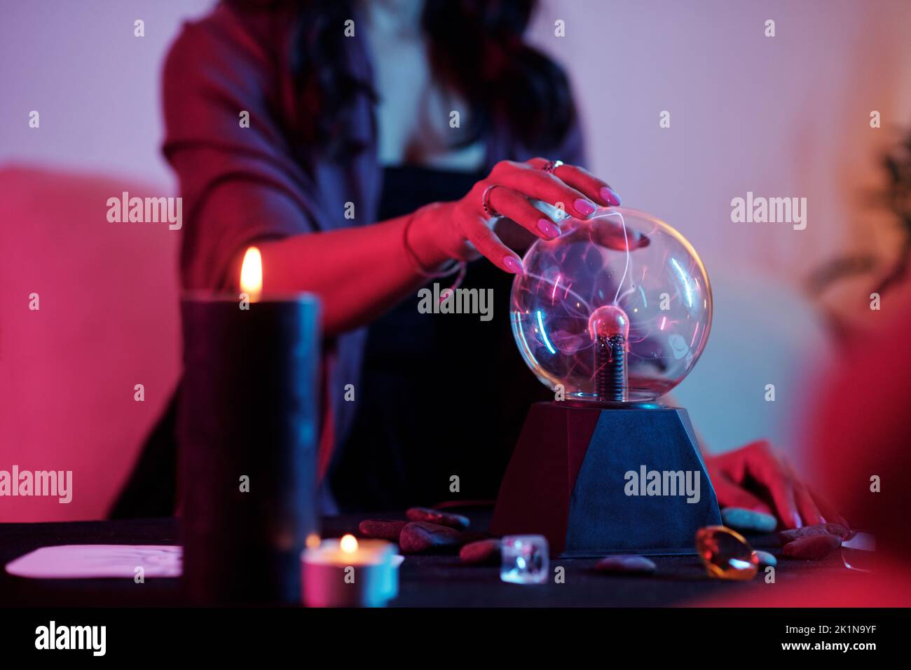 Fortune teller putting hand of crystal ball to predict fate Stock Photo ...