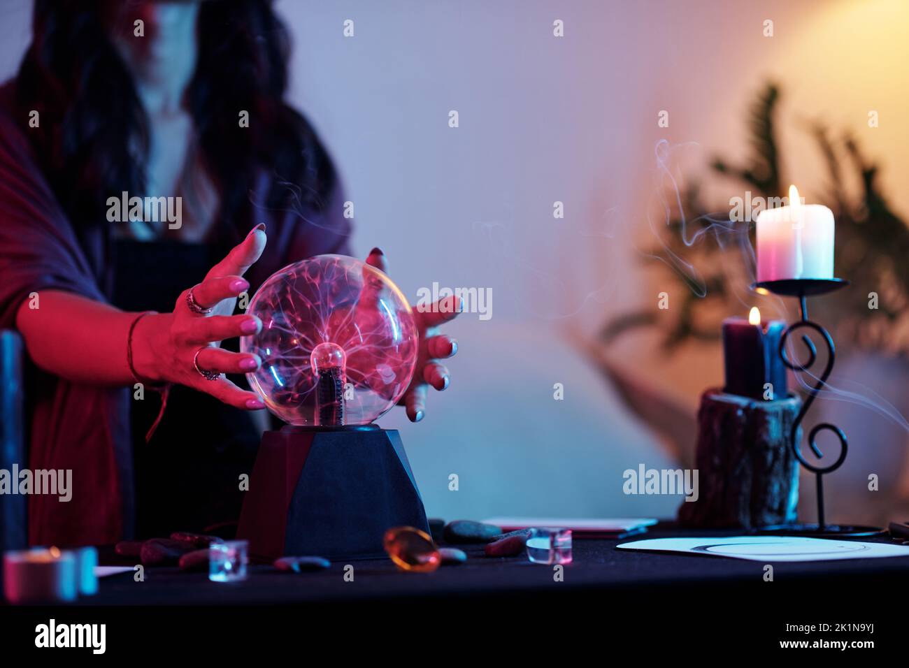 Fortune teller burning candles when seeing fortune in crystal ball ...