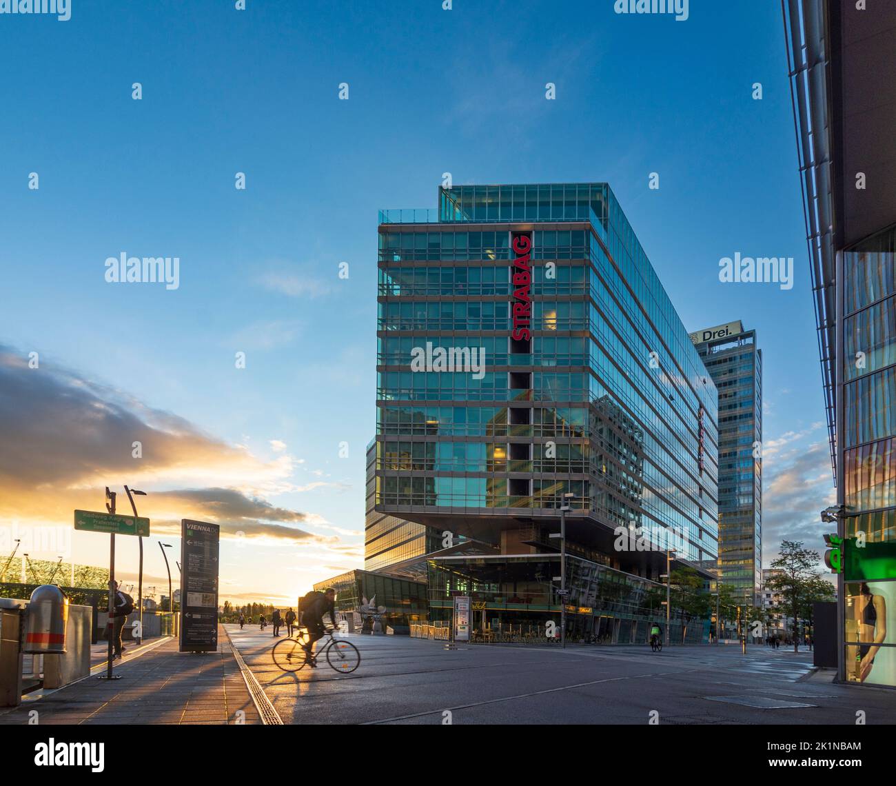 Wien, Vienna: Strabag Headquarters in Donaucity, pedestrians at sunset ...