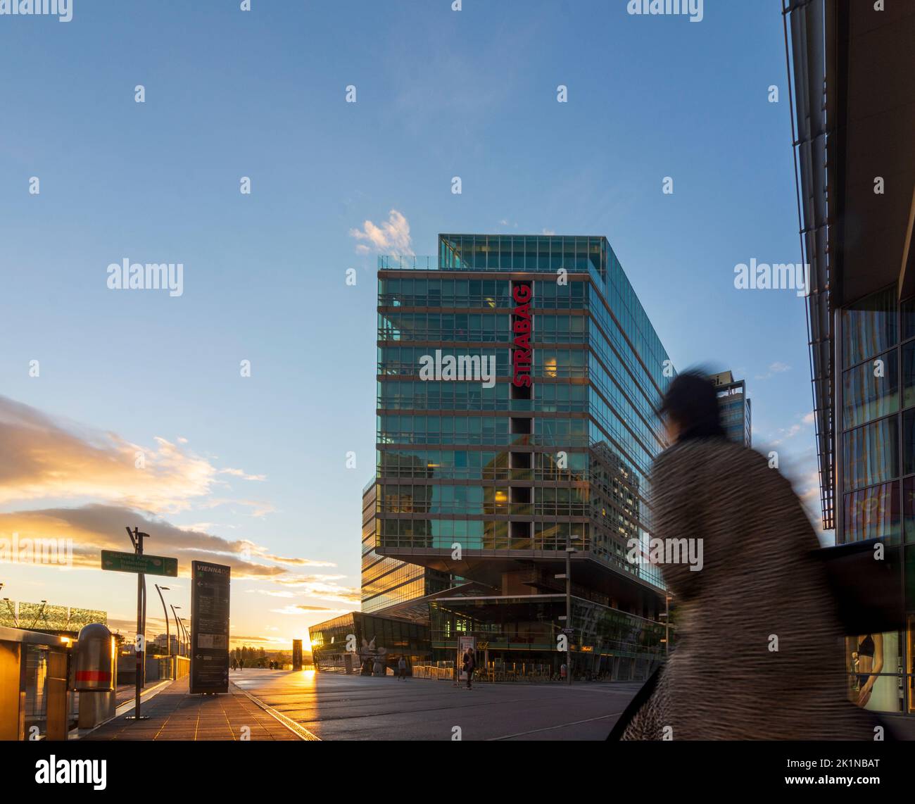 Wien, Vienna: Strabag Headquarters in Donaucity, pedestrians at sunset ...