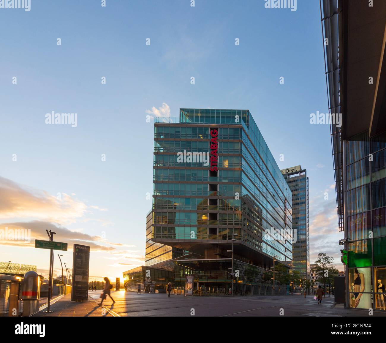 Wien, Vienna: Strabag Headquarters in Donaucity, pedestrians at sunset ...