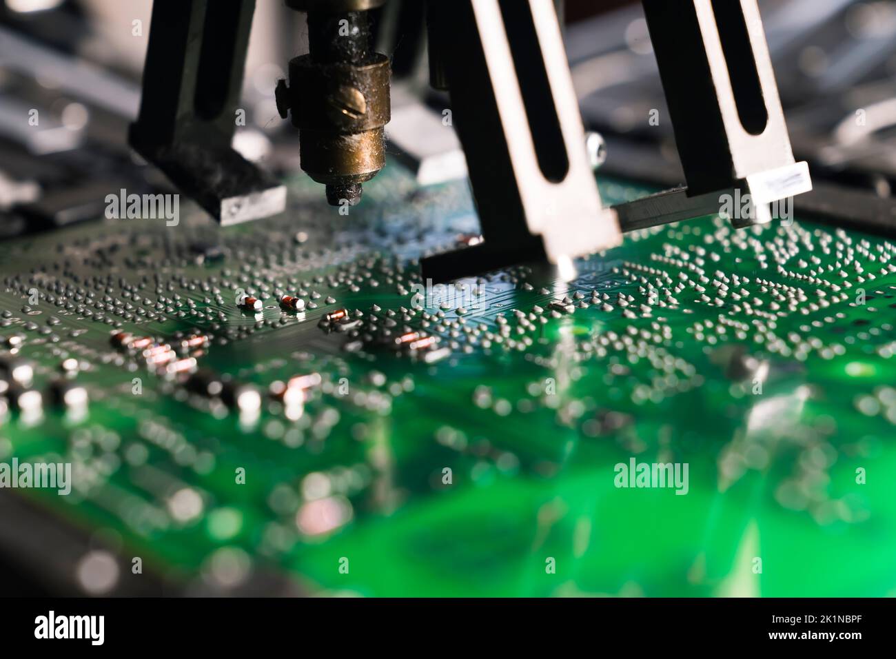 Close-up shot of SMD surface-mount device working on printed circuit ...