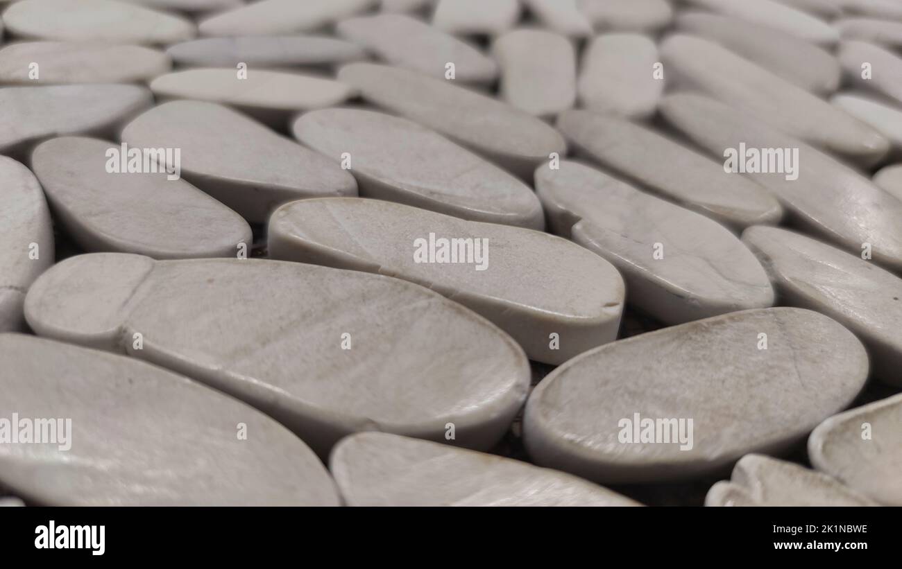 White and grey pebble stone texture wall as a background Stock Photo ...