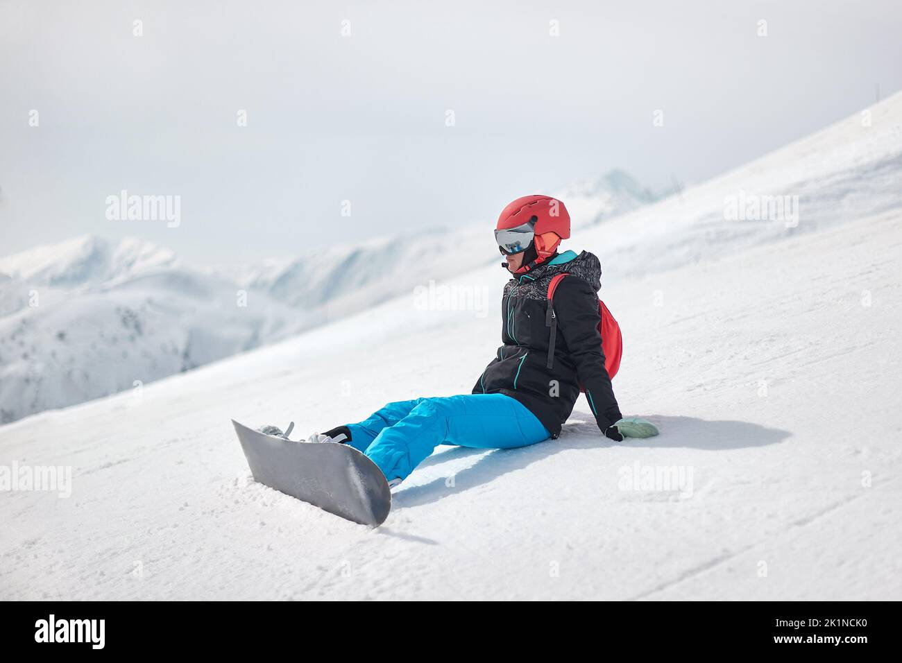 Snowboarding girl sitting on hi-res stock photography and images - Alamy