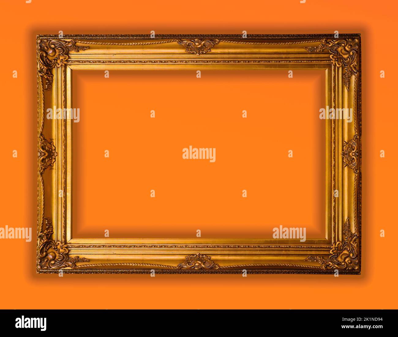 Shiny gold vintage frame isolated on orange background Stock Photo - Alamy