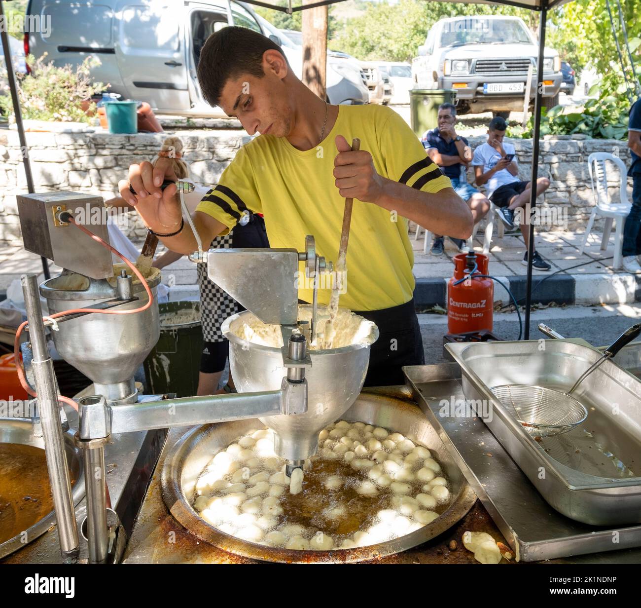 Loukoumades (Cypriot doughnuts) being made at the Statos-Agios Fotios ...
