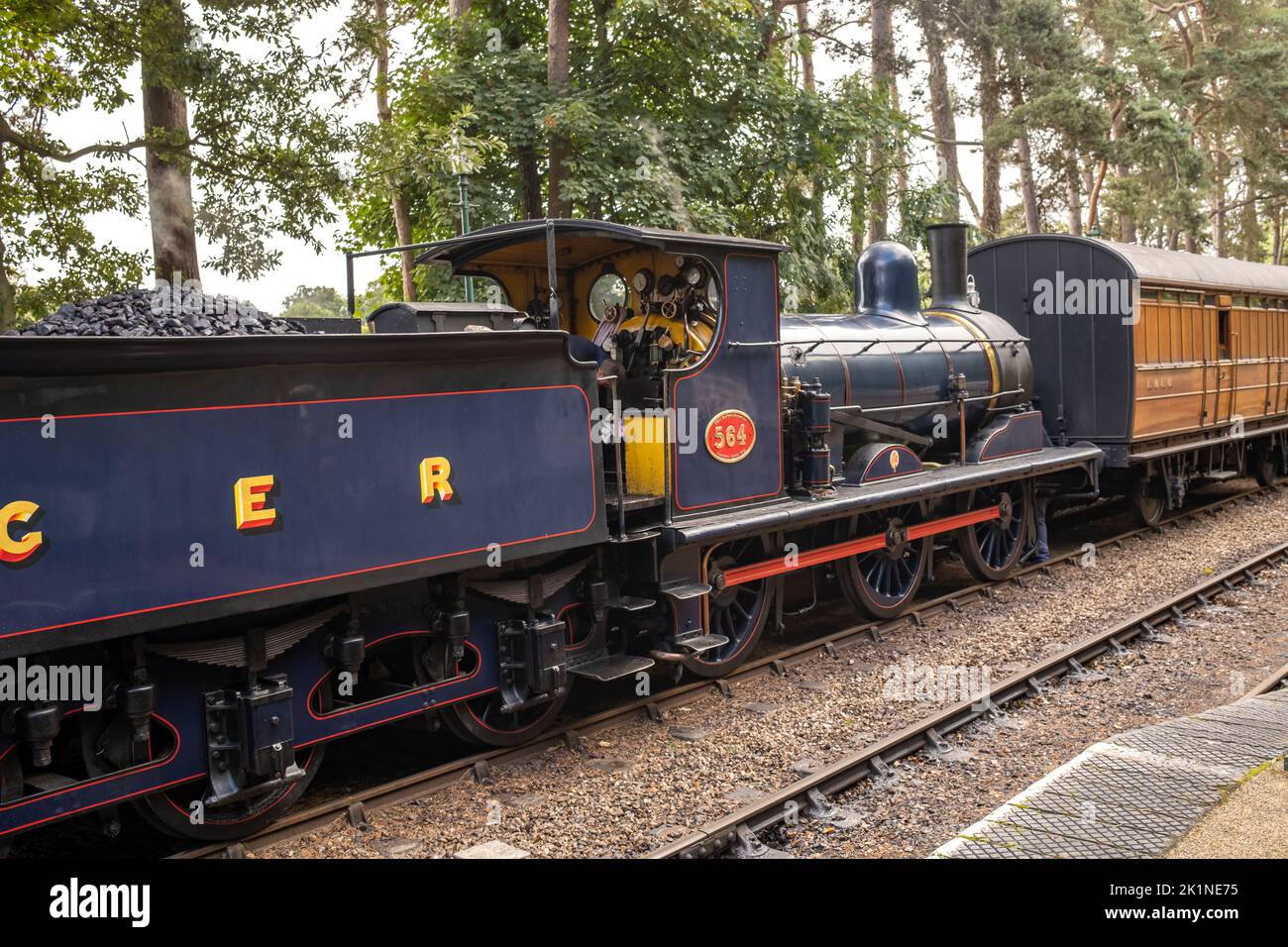 40. Vintage steam train and wooden passenger carriages in Holt station ...
