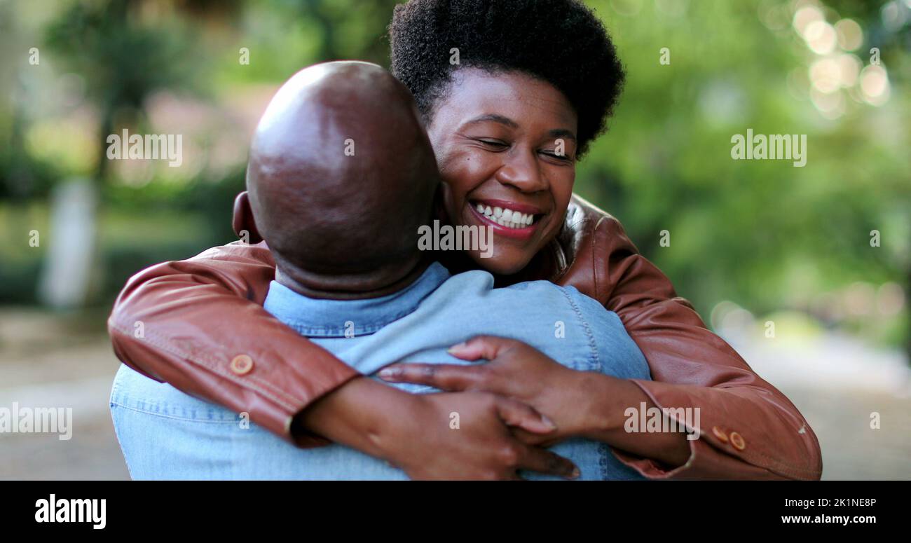 African people hugging, woman running towards partner hugs and embrace ...
