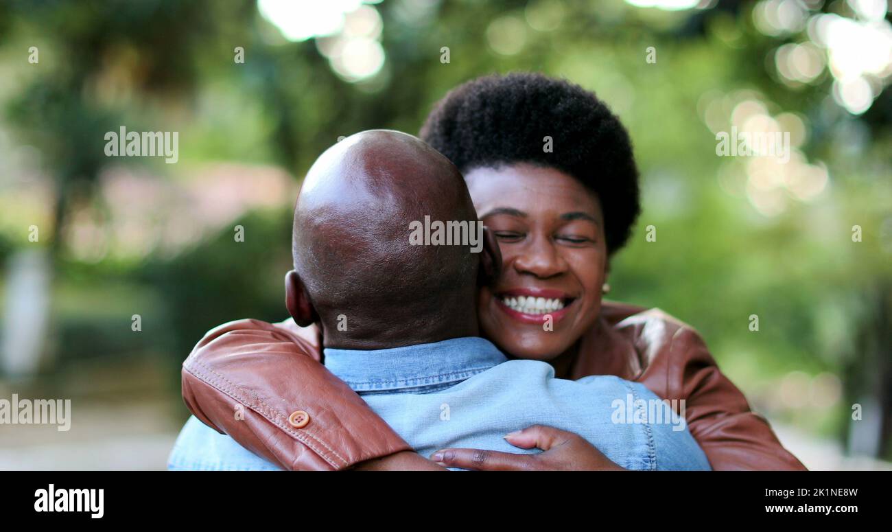 African people hugging, woman running towards partner hugs and embrace ...